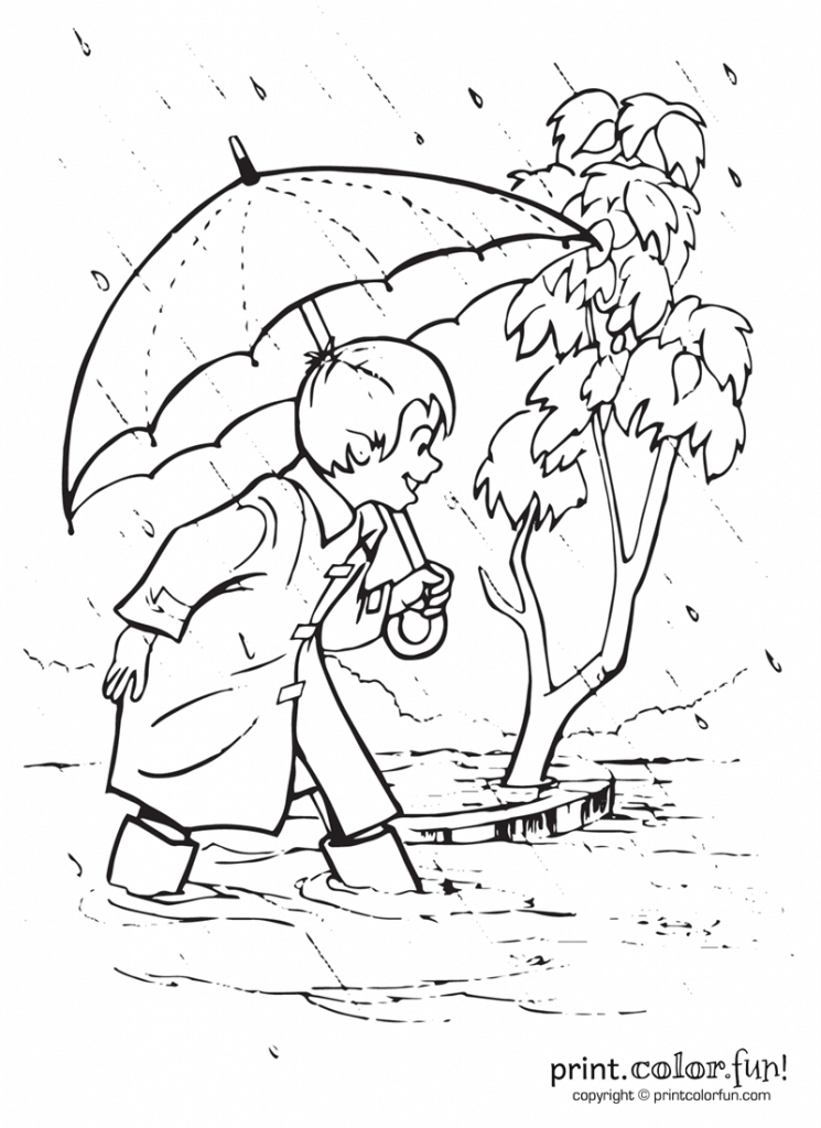 Boy playing outside in the rain, at PrintColorFun.com